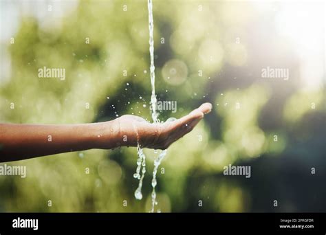 Every Drop Is Precious Hands Held Out To Catch A Stream Of Water