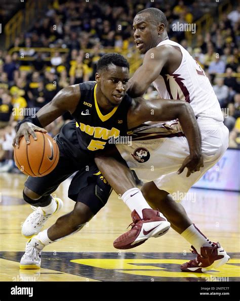 Iowa Guard Anthony Clemmons Drives Past Florida State Guard Montay