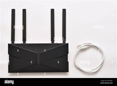 Modern Black Wi Fi Router On A White Background With Ethernet Cable Stock Photo Alamy