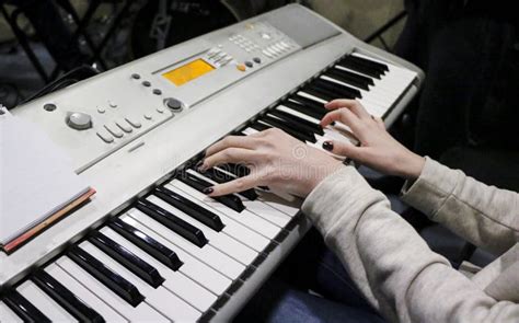 A Young Girl Pianist Plays The Electronic Piano With Her Favorite Music
