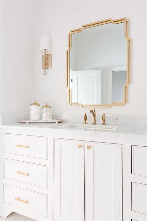 Gold And White Bathroom With Inset Cabinets