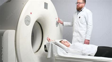 Young Woman Is Undergoing A Ct Scan Procedure Pretty Female In A Modern Laboratory Lying On