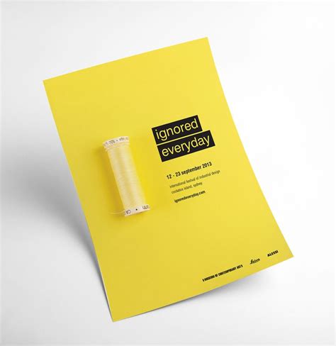A Yellow Brochure With A Roll Of Thread On It