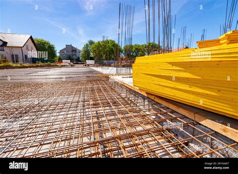 Perspective View On Rusty Quadratic Reinforcement Armature Mesh Placed In Foundation For