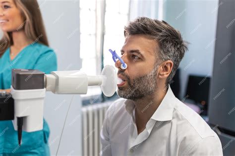 Premium Photo Man Performing Pulmonary Function Test And Spirometry Using Spirometer At