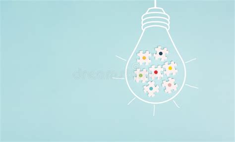Light Bulb With Jigsaw Or Puzzle Pieces Brainstorming For Ideas Finding Solution Solving A