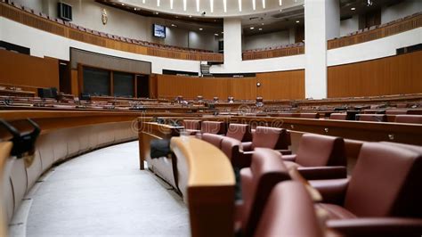 Generative Ai Spacious Interior Of A Legislative Assembly Hall Featuring Rows Of Empty Seats And