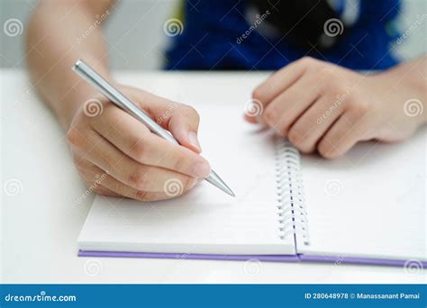 Asian Teenage Student Write Homework Study Lesson For Exam Online
