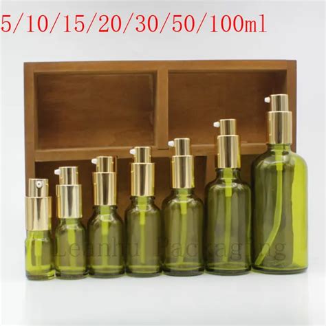 Green Glass Lotion Cream Makeup Bottles With Golden Lotion Pumpempty