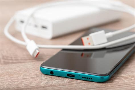 Premium Photo Using Modern Fast Usb Typec Cable For Recharging Mobile