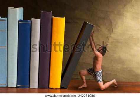 Naked Man Supporting Falling Book Bookshelf Stock Photo Shutterstock