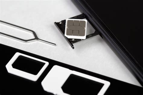 Premium Photo Sim Card Inserted On The Sim Card Tray Of A Smartphone With Pin Needle Tray Remover