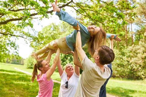 Group Of Young People Lifts Up A Woman Stock Image Image Of Game