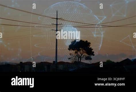 As Dusk Falling Wireframe Globe Appearing With Rotating Rings Between Pylons Showing