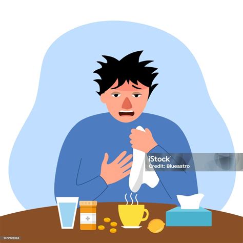 독감으로 고통받는 아픈 사람이 테이블에 약 티슈 페이퍼 물 레몬을 가지고 앉아 있습니다 그는 손수건으로 재채기를하고 열이