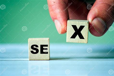 Symbol Of Sex With Word On Wooden Cube Blocks Hand Hold One Cube Stock