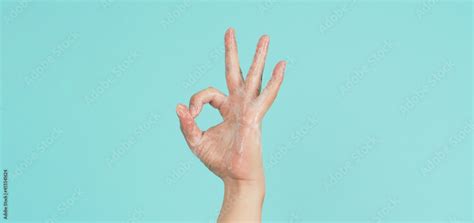 Hand Doing Okeyok Hand Sign Gesture And Wash Foaming Hand Soap On