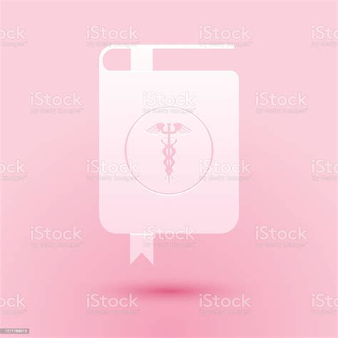 종이 잘라 의료 책과 분홍색 배경에 고립 된 Caduceus 의료 아이콘 의료 참조 책 교과서 백과 사전 과학 문헌 종이 아트