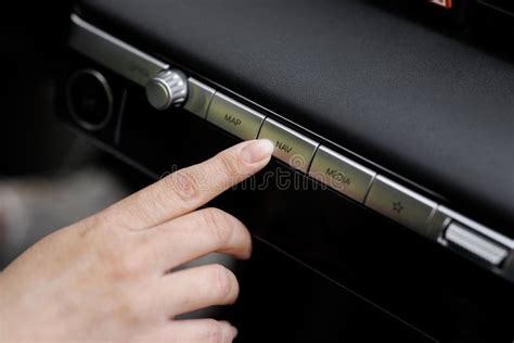 Close Up Of A Personand X27s Hand Using Gps Navigation System In Car Woman Using Navigation