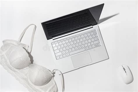 Erotic Chat Virtual Sex Concept White Bra Thrown On A Modern Laptop Against A White