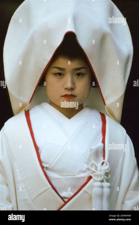 Japanese Bride Wearing Traditional White Wedding Kimono And Bridal Hood