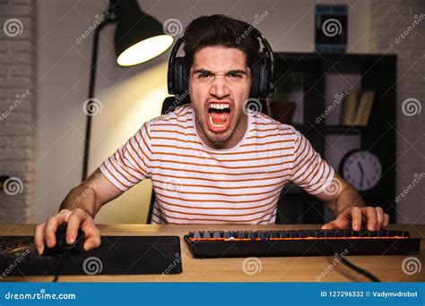 Angry Irritated Female Holds Hands To Her Head And Screams People`s