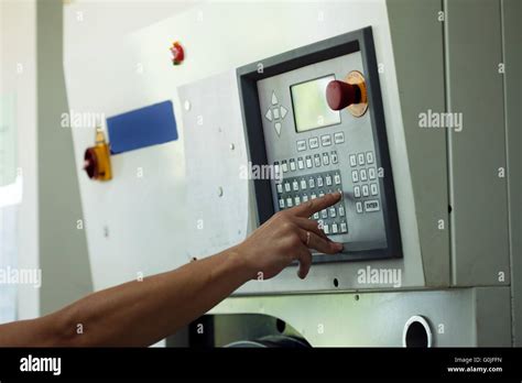 Man Presses Button On Electronic Control Panel Stock Photo Alamy