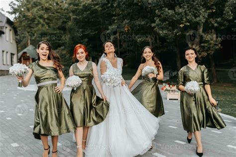 Beautiful Bride And Her Friends Bridesmaids Having Fun After Wedding