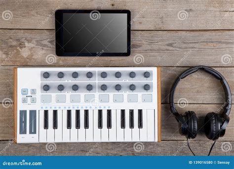 Close Up Of MIDI Controller Volume Fader Knob And Keys Stock Photo