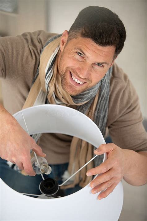 Man Changing Light Bulb In Lamp Indoors Stock Image Image Of Service Green