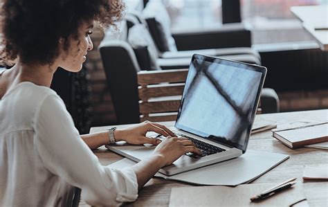 Person Typing On Laptop