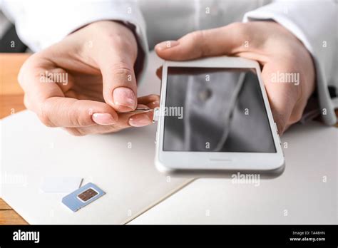 Woman Opening Sim Card Slot With Key Closeup Stock Photo Alamy