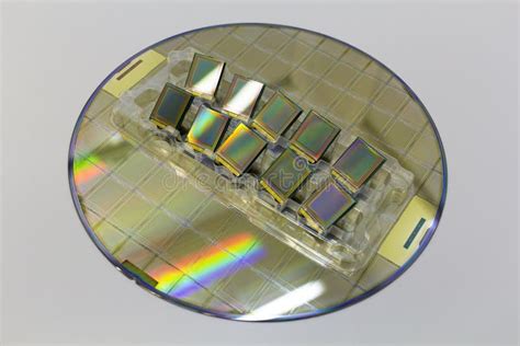 Silicon Wafers And Ready Made Microchips Lying In A Tray On The Surface Stock Photo Image Of