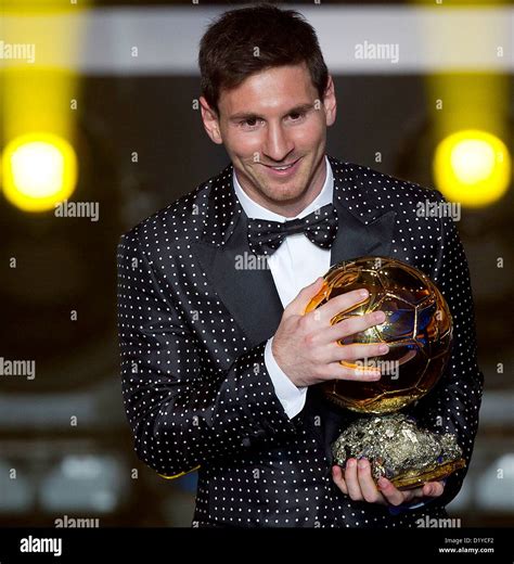 Lionel Messi Of Argentina Holds The Trophy Alloft After Winning The