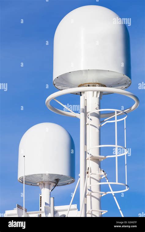 White Gps Tracking Antennas Mounted On The Top Mast Of Modern Passenger
