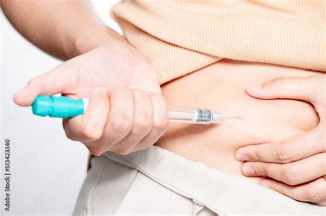 Woman Making Hormonal Therapy Injection Into Her Belly Close Up Syringe Pen Concept