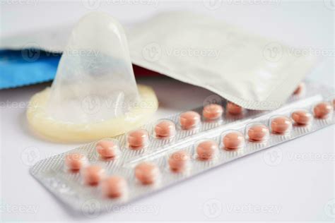Pregnancy Test With Birth Control Pills And Condom For Female On