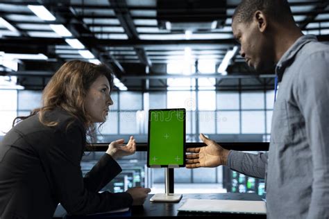 Programmers In Data Center Brainstorming Using Mockup Tablet Stock