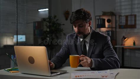 Adult Business Man Manager Sitting At Desk Working On Laptop In Office