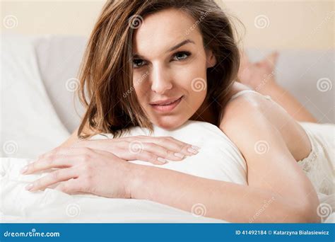 Beautiful Woman Smiling Seductively In Bed Stock Photo Image Of Face Hair
