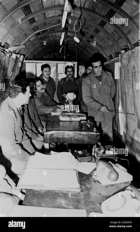 Iraqs President Saddam Hussein Listens To Explanations On A Map Of The