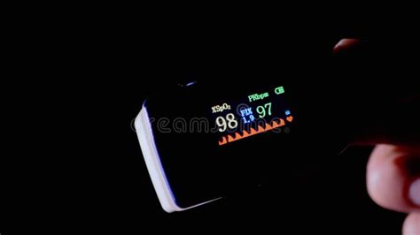 Woman Measures Pulse And Oxygen Saturation Using A Pulse Oximeter At Home Stock Video Video Of