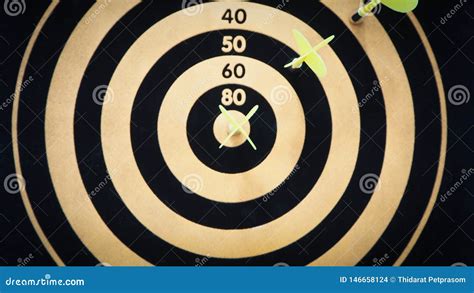 Black And Yellow Bullseye Dart Arrow Hitting Target Center Of Dartboard