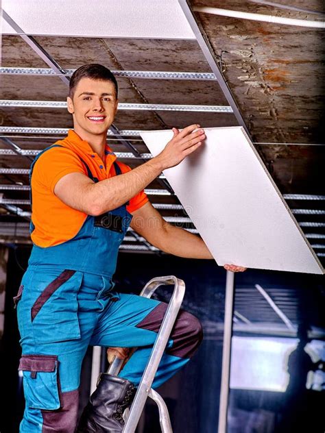 Man Installing Suspended Ceiling Stock Photo Image Of Flat Home