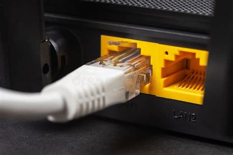 Connect An Ethernet Cable To A Wireless Router On Dark Ethernet Rj45 And Electric Cables