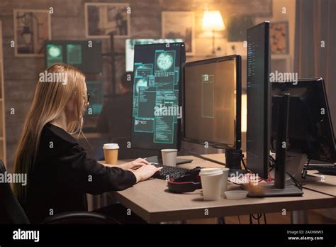 Dangerous Female Hacker Writing A Virus On Computer To Steal Credit