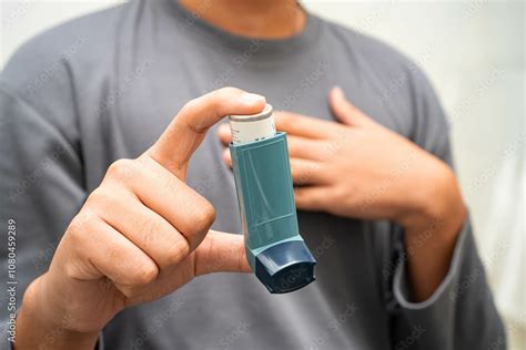 Asthma And Chronic Obstructive Pulmonary Disease Copd Asian Young Man Using Metered Dose