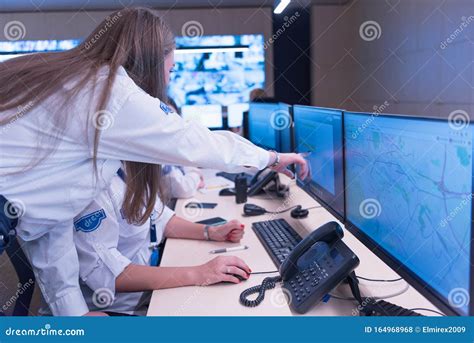 Security Guard Monitoring Modern Cctv Cameras In Surveillance Room