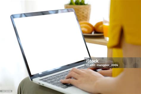 Woman Hands Using Laptop Computer With Blank Screen For Mock Up Template Background Business