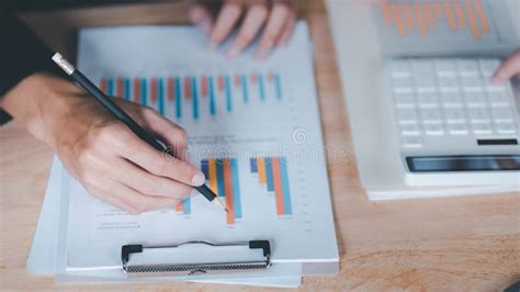 Statistical Analyst Using Calculator To Calculate And Read Reports Graphs And Charts Business